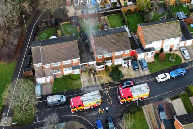 Firefighters descend on Swindon street as house on fire