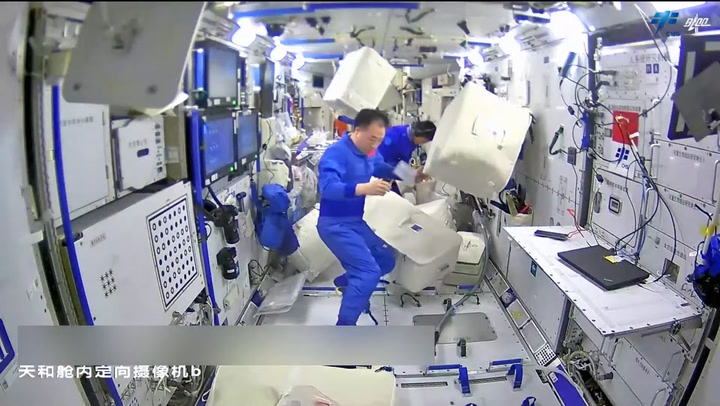 Chinese astronauts cleaning the Tiangong Space Station