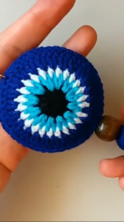 Unlock positive energy with a handmade crochet evil eye keychain gift