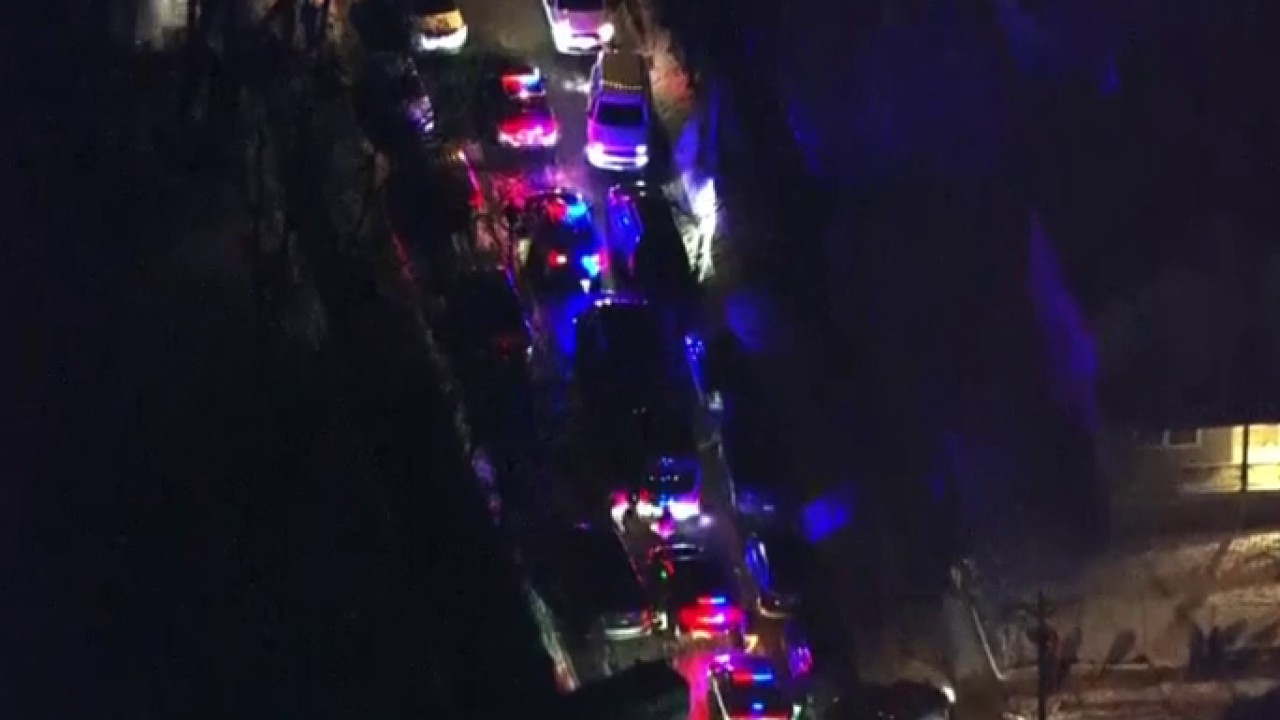 Law enforcement respond to large north Minneapolis crowd after ICE shooting