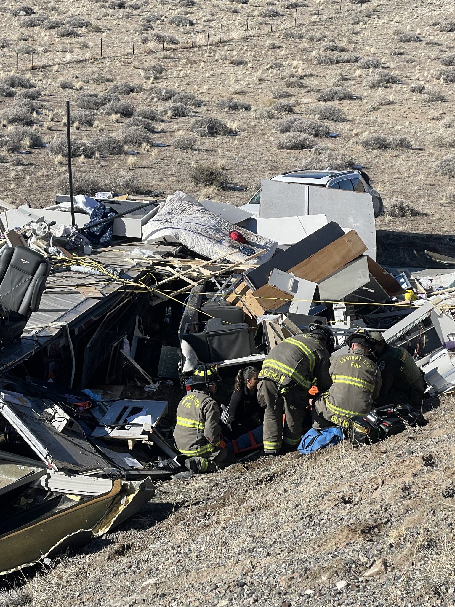 Motorhome runs off road, rolls, traps one person inside