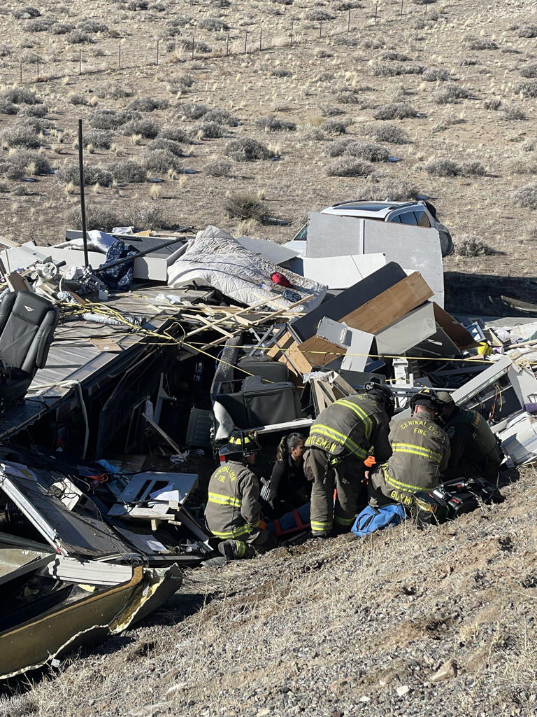 Motorhome runs off road, rolls, traps one person inside
