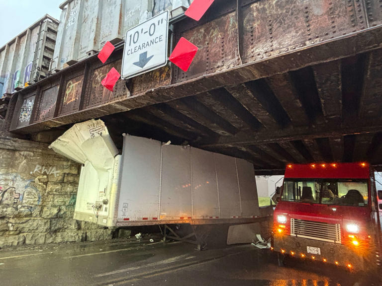Truck’s roof ripped off after hitting railroad bridge in DeWitt