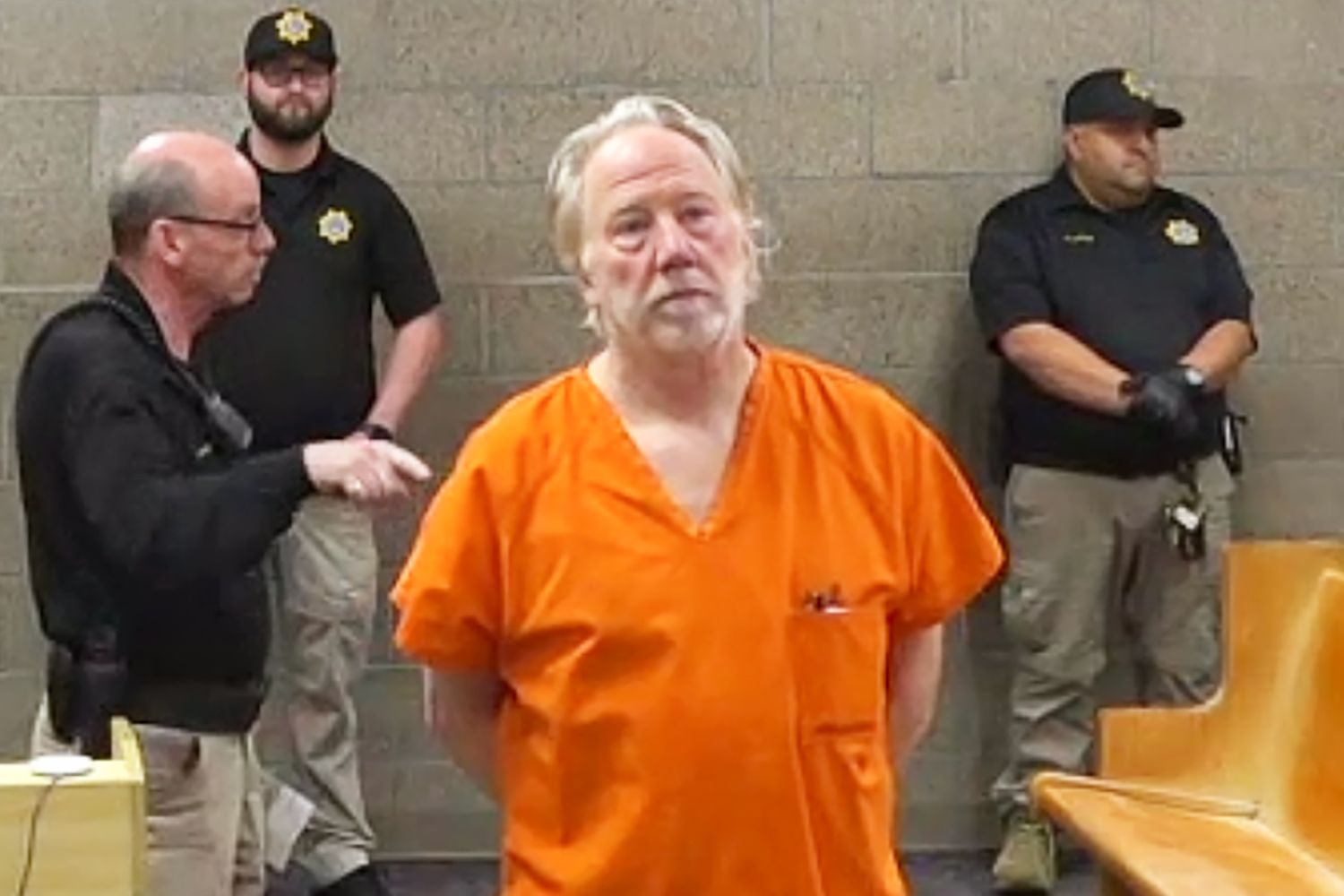 Timothy Busfield, wearing orange jail uniform, looks downcast in first ...