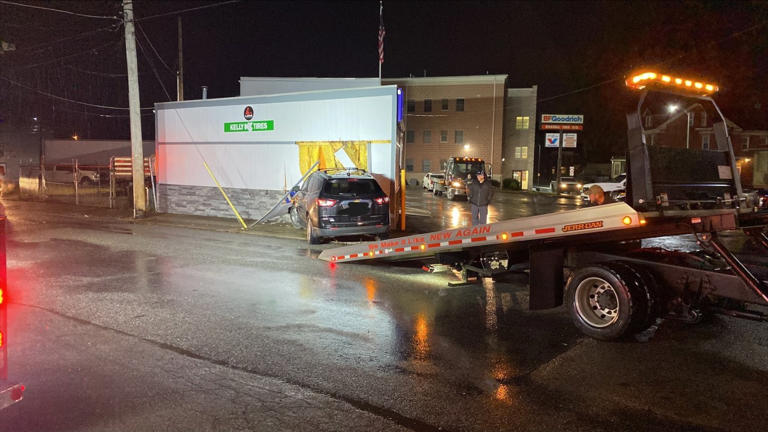 Photos: Car crashes into Altoona tire business