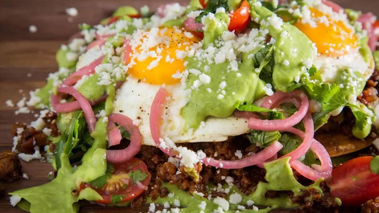 Chorizo huevos rancheros with avocado salsa