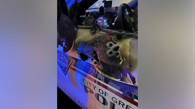 Video shows police officer ambushed in patrol car in explosion of ...