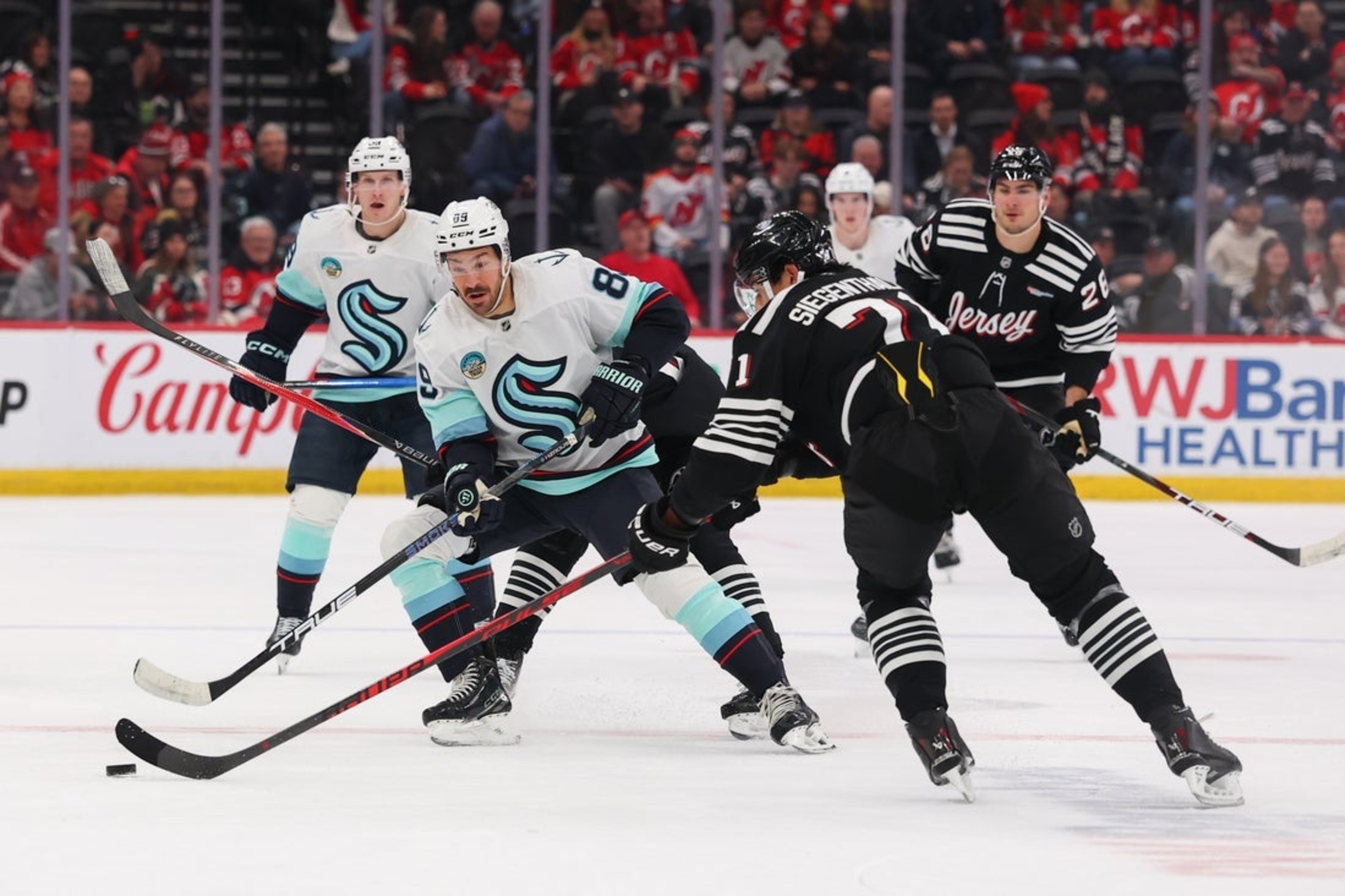 Unable to hold two leads, Devils sink Kraken in OT