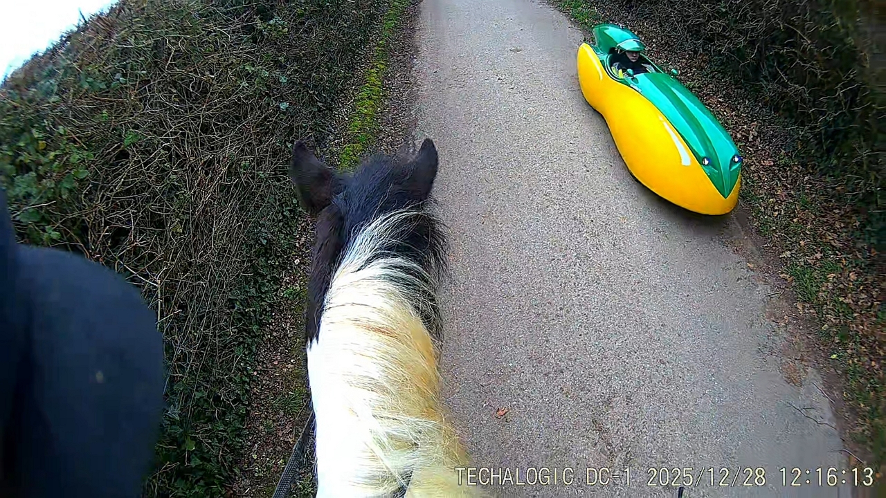 Velomobile passes rider and pony on Isle of Wight, England, UK