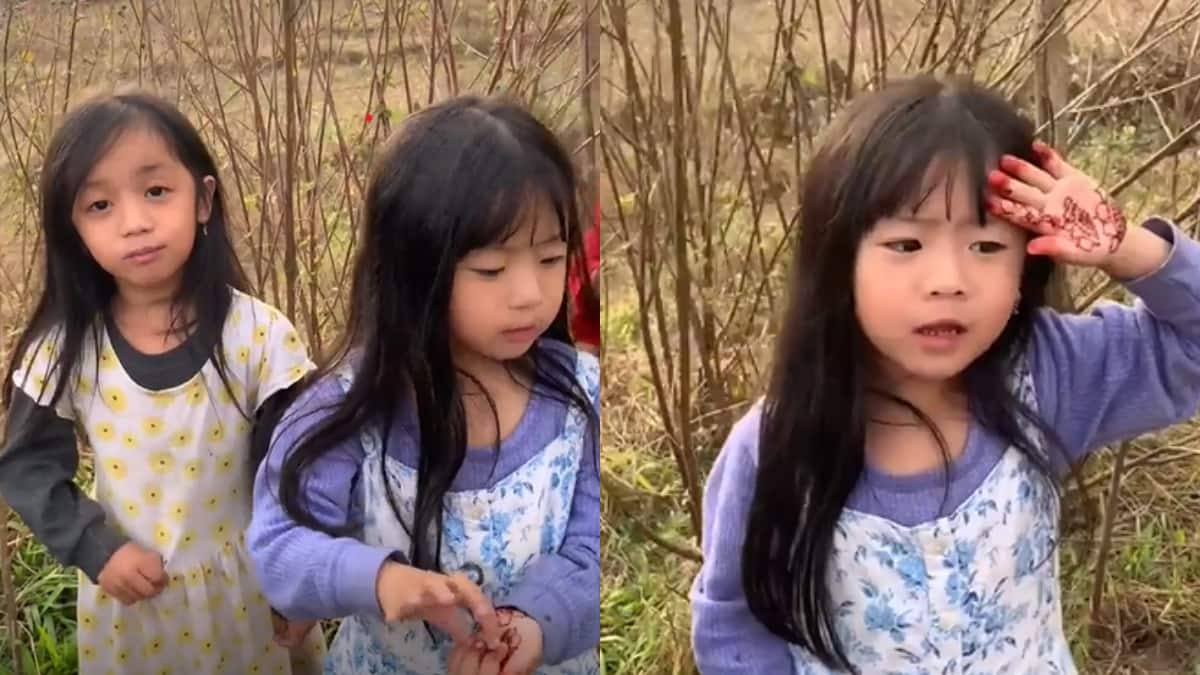 Two tiny girls stumble through patriotic song, salute with innocence ...
