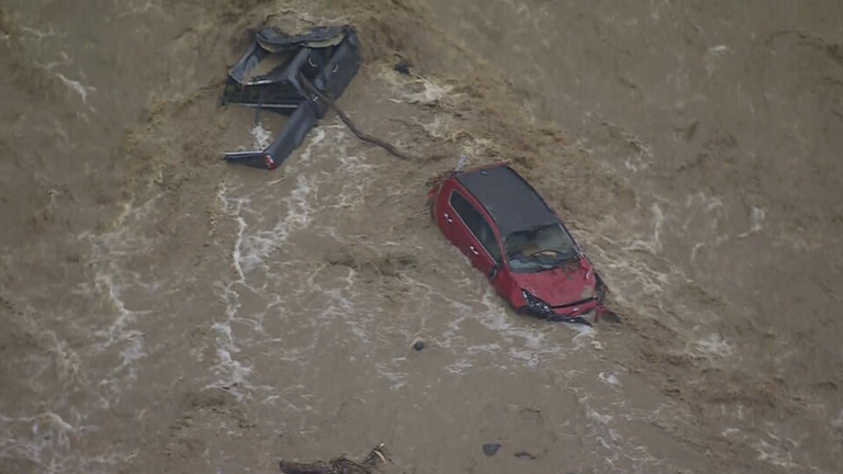 One rescued, dozens of cars swallowed by flash flooding at Victorian ...