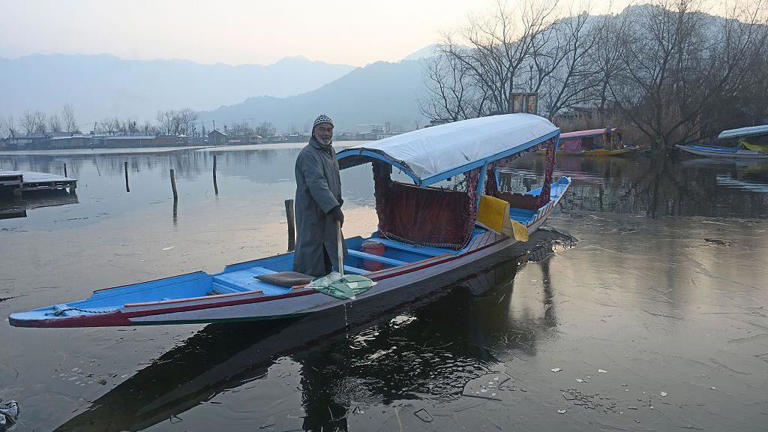 In pictures: Fog and frozen lakes as cold weather sweeps northern India