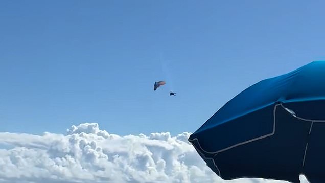 Paraglider survives 500ft drop into ocean after equipment fails