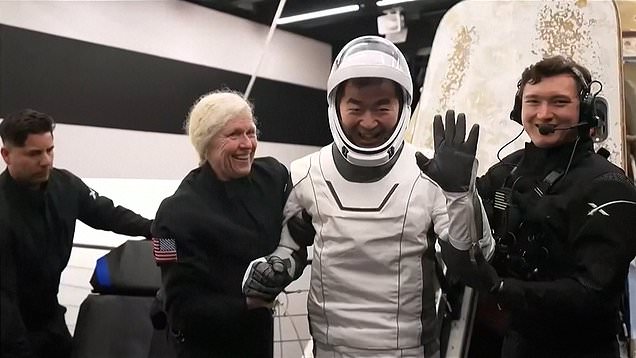 Astronauts emerge after medical evacuation splash down from ISS