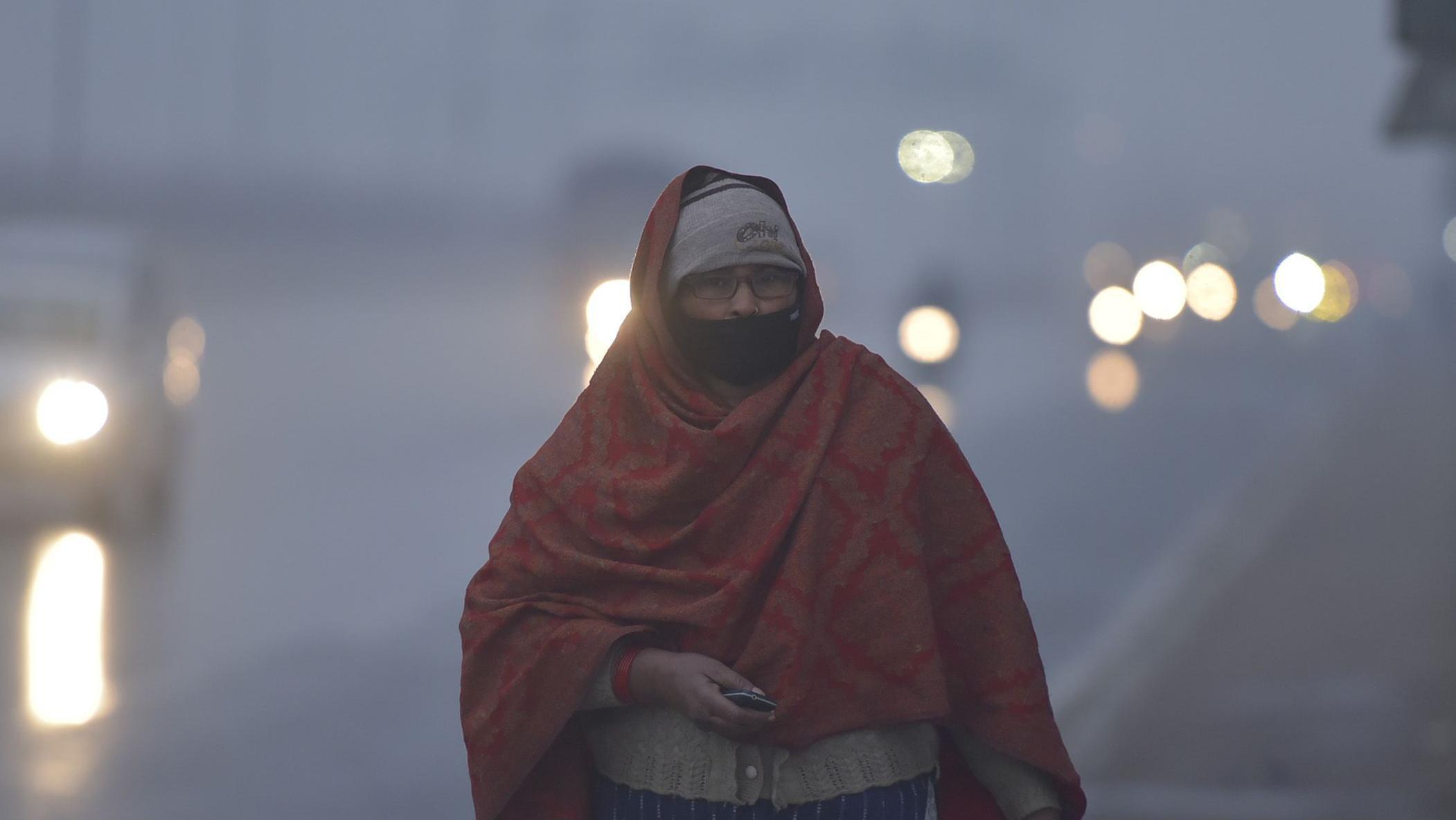In pictures: Fog and frozen lakes as cold weather sweeps northern India