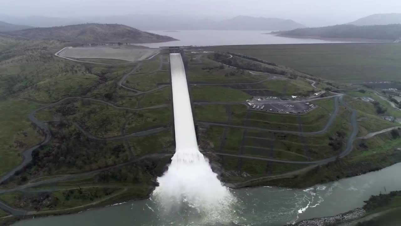 Dam gates open for flood control in California