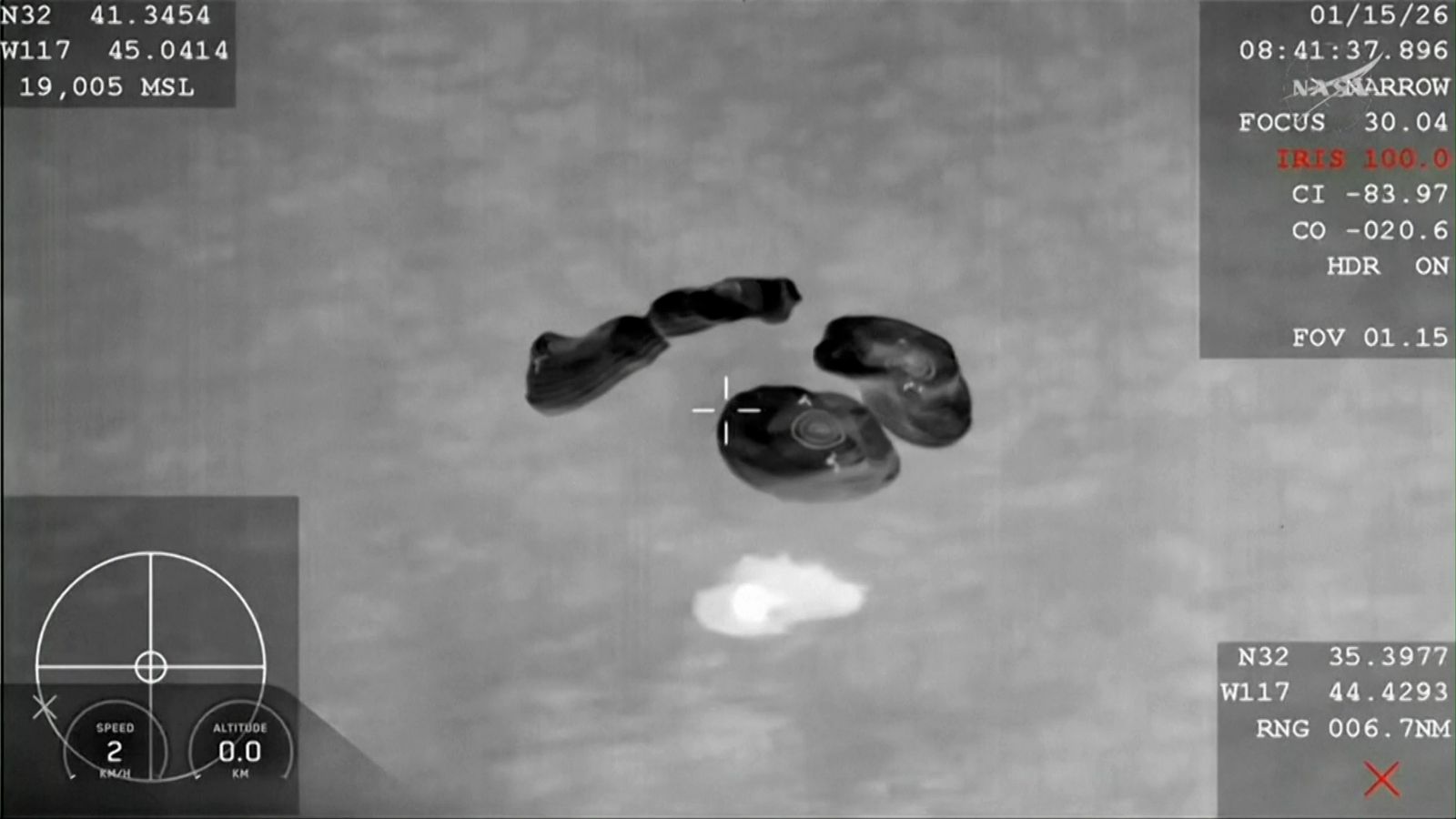 Moment space capsule splashes down