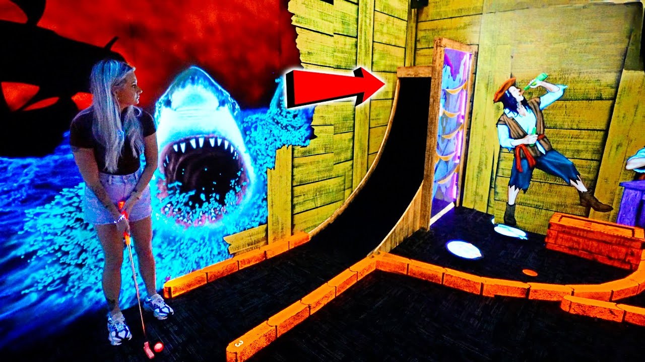 We found the coolest blacklight mini golf course ever!