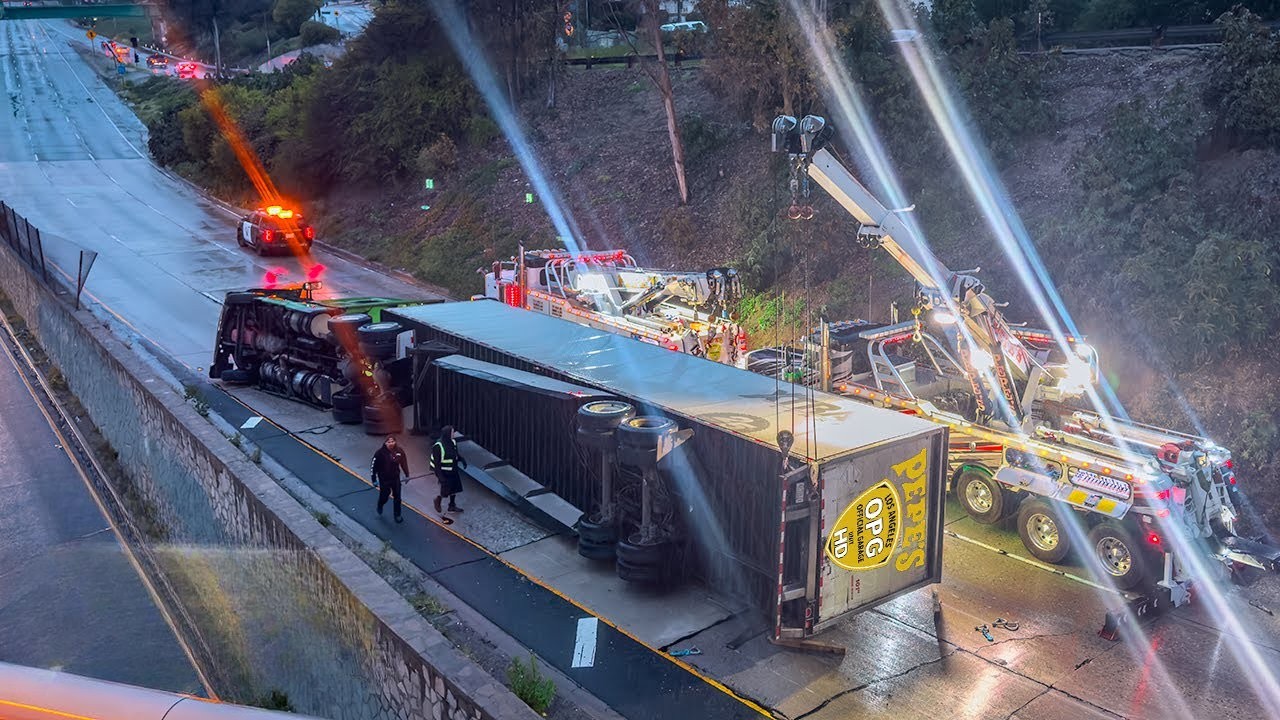 Freeway shut down for a loaded tractor trailer rollover: heavy rescue