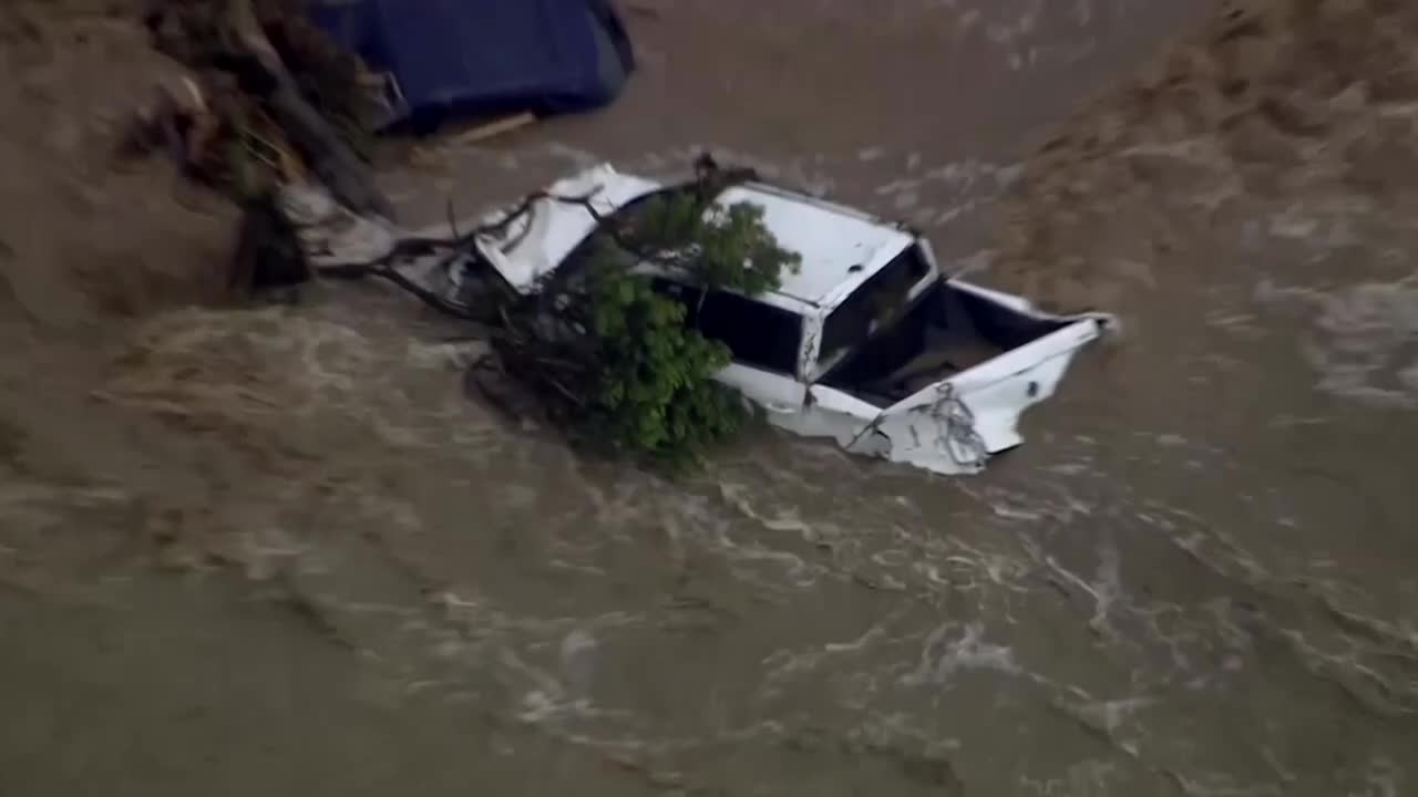 Aerial footage shows cars swept out to sea as floods hit Australia