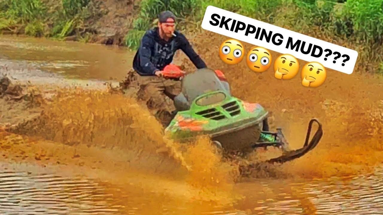Snowmobile mudding goes sideways when the quad disappears