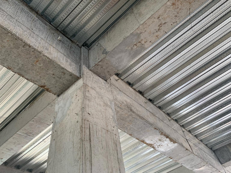 Steel I- and T-sections restore strength in concrete beams weakened by ...