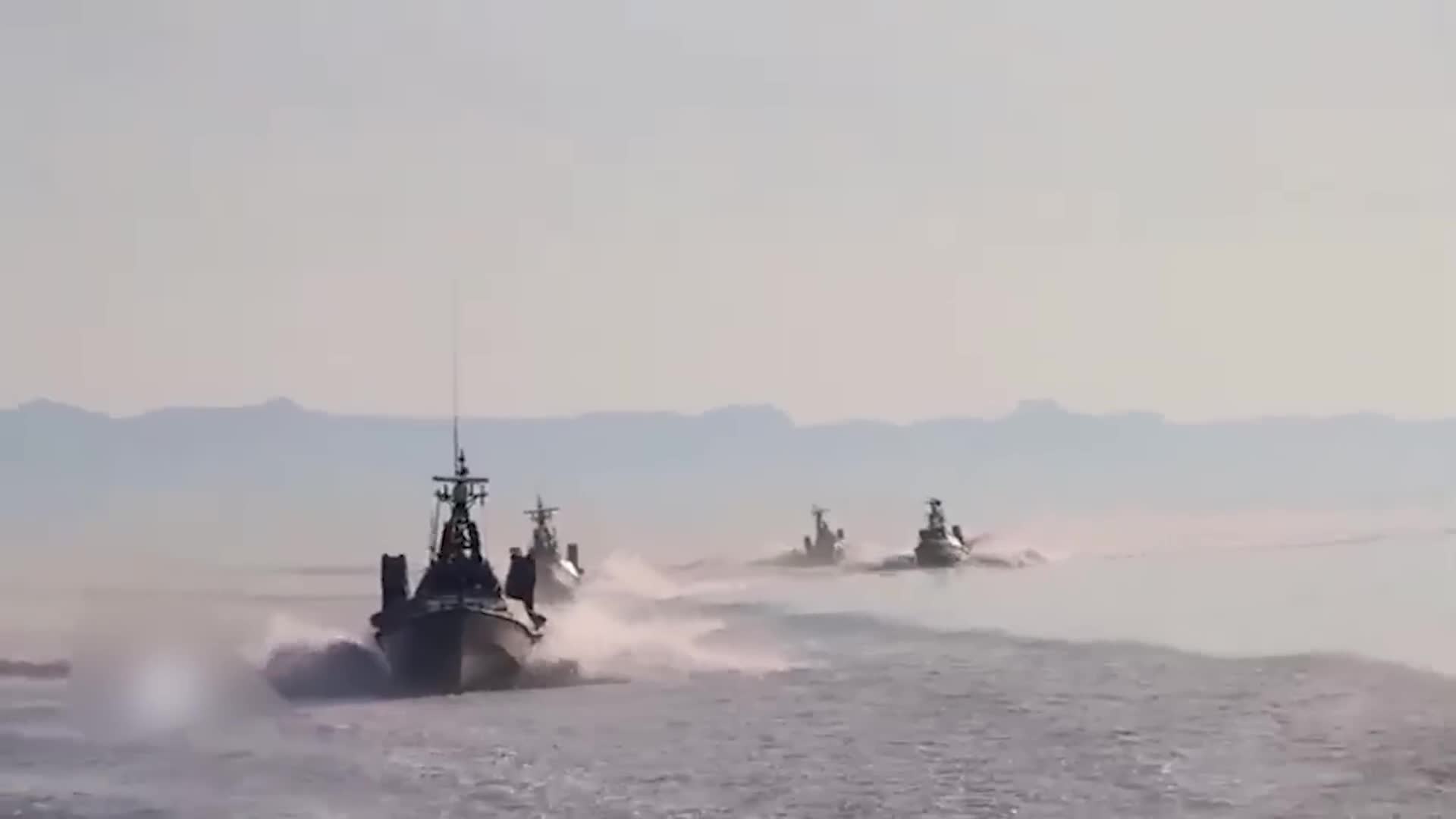 Revolutionary Guard speedboats swarm destroyer