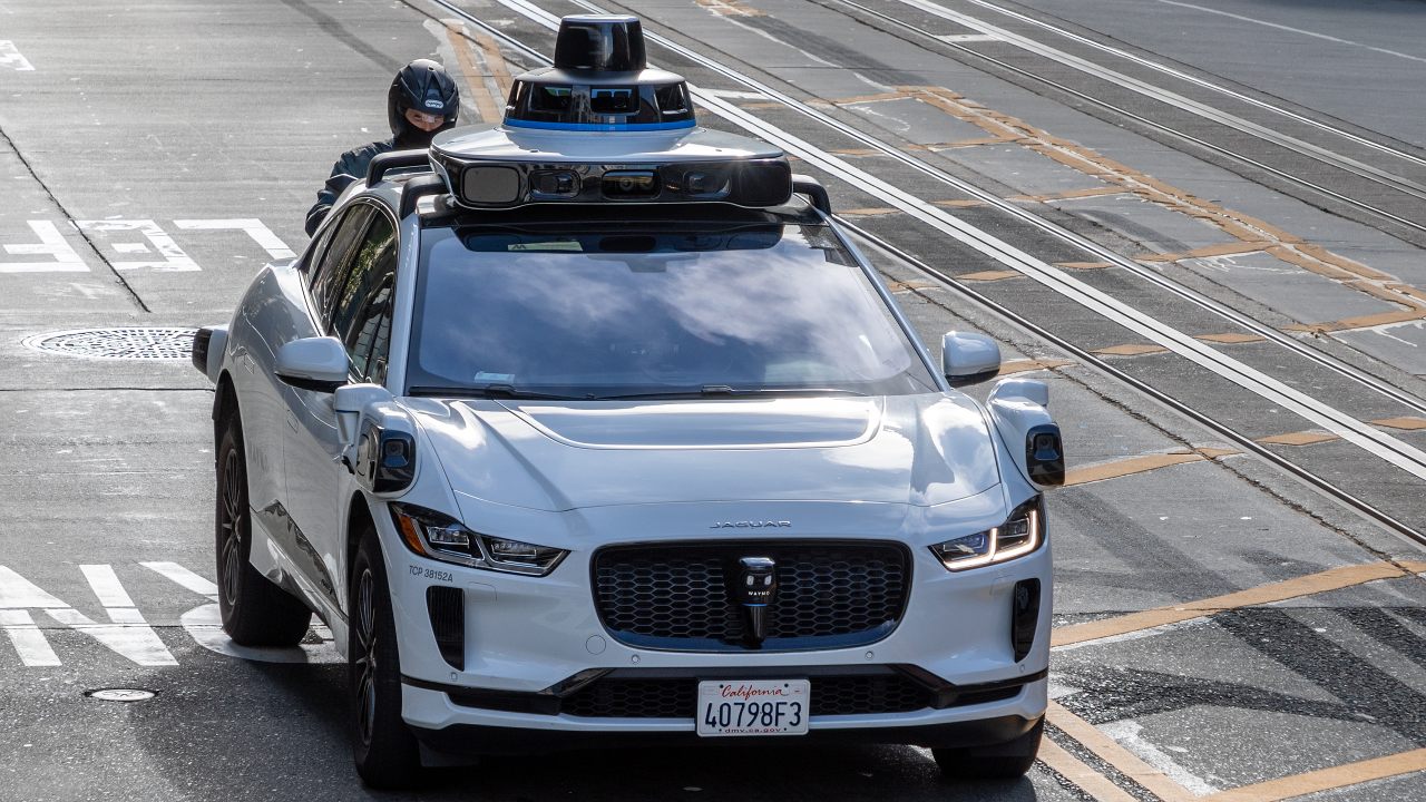 Waymo robotaxi spotted driving down active light rail tracks