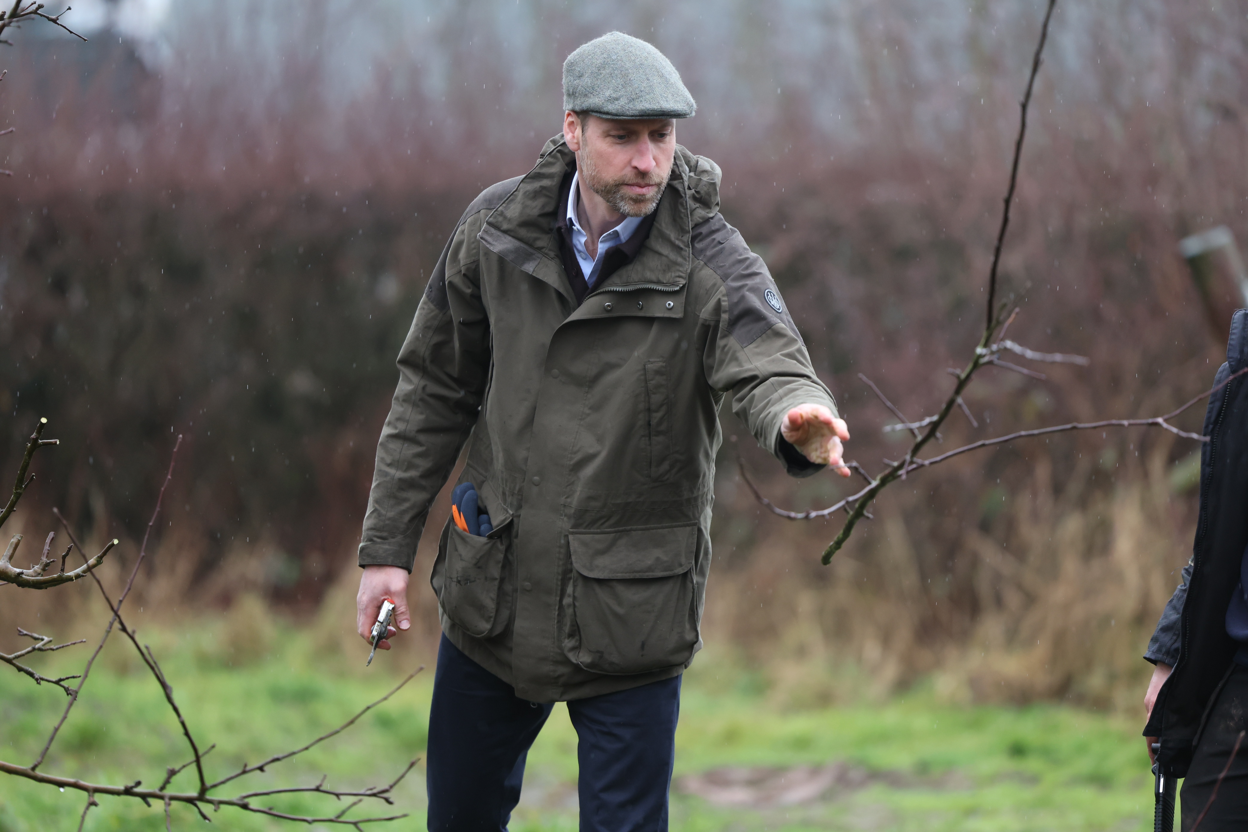 Prince of Wales branches out into tree-pruning on visit to family farm