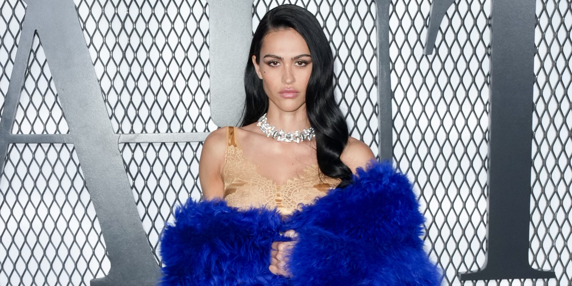 Amelia Gray dresses up a teeny slip dress with a fabulous blue fur