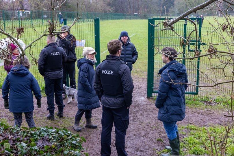 Police called to 'hostile' school playing field stand-off