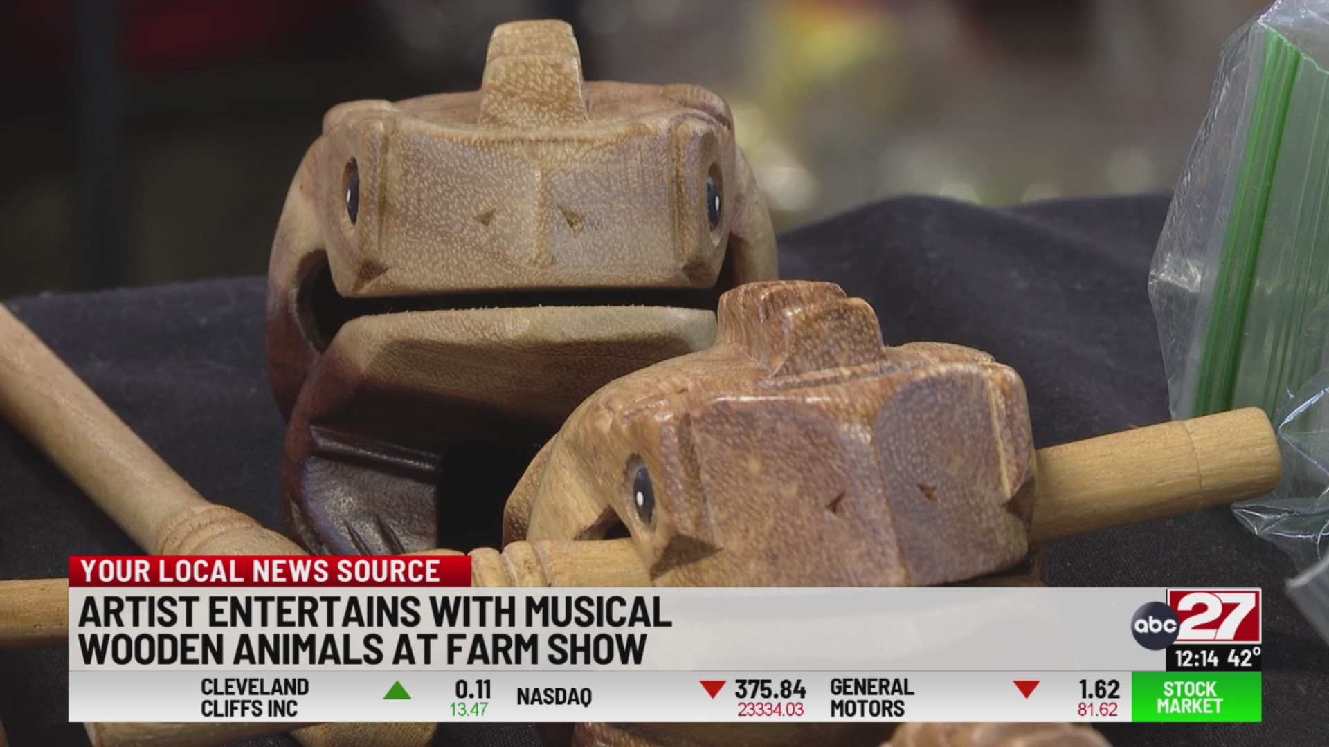 Artist entertains with musical wooden animals at the Farm Show