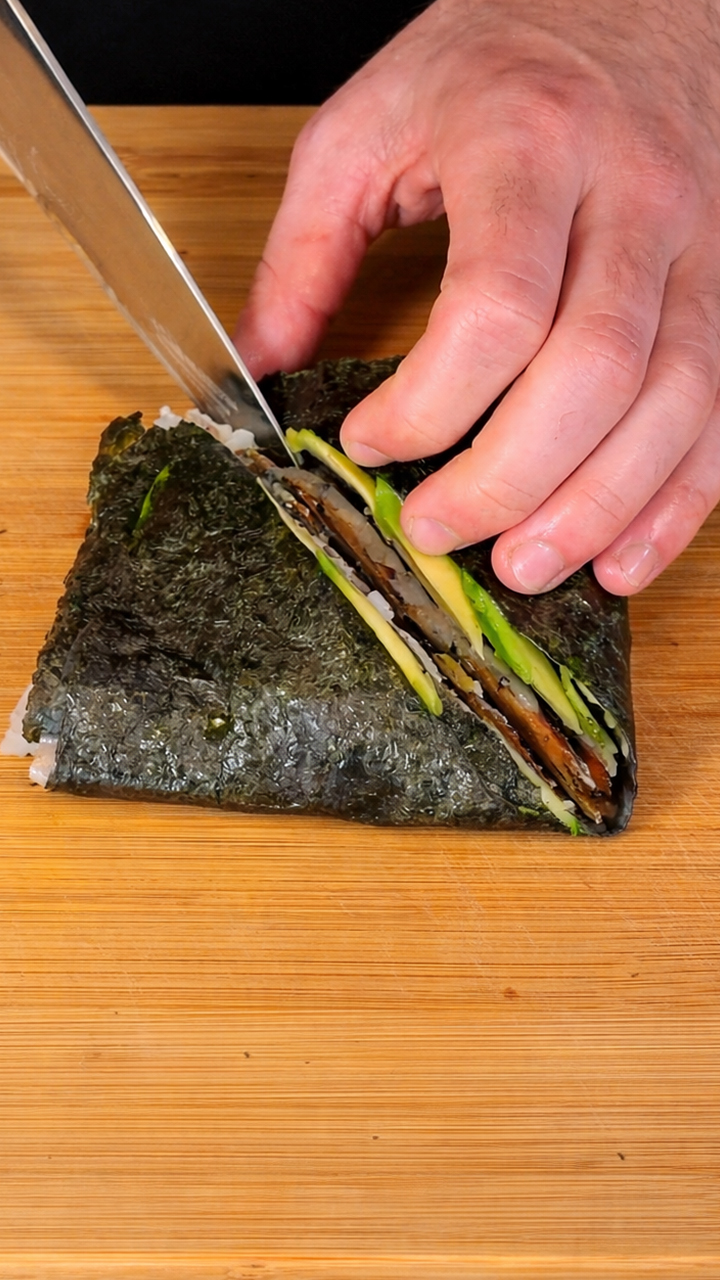 Making vegan sushi wraps with teriyaki tofu