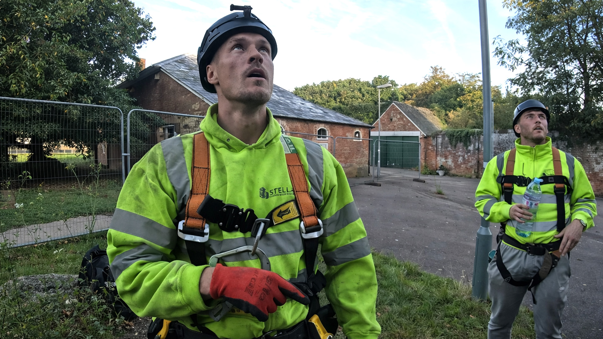 Working on the scaffolding over a mansion
