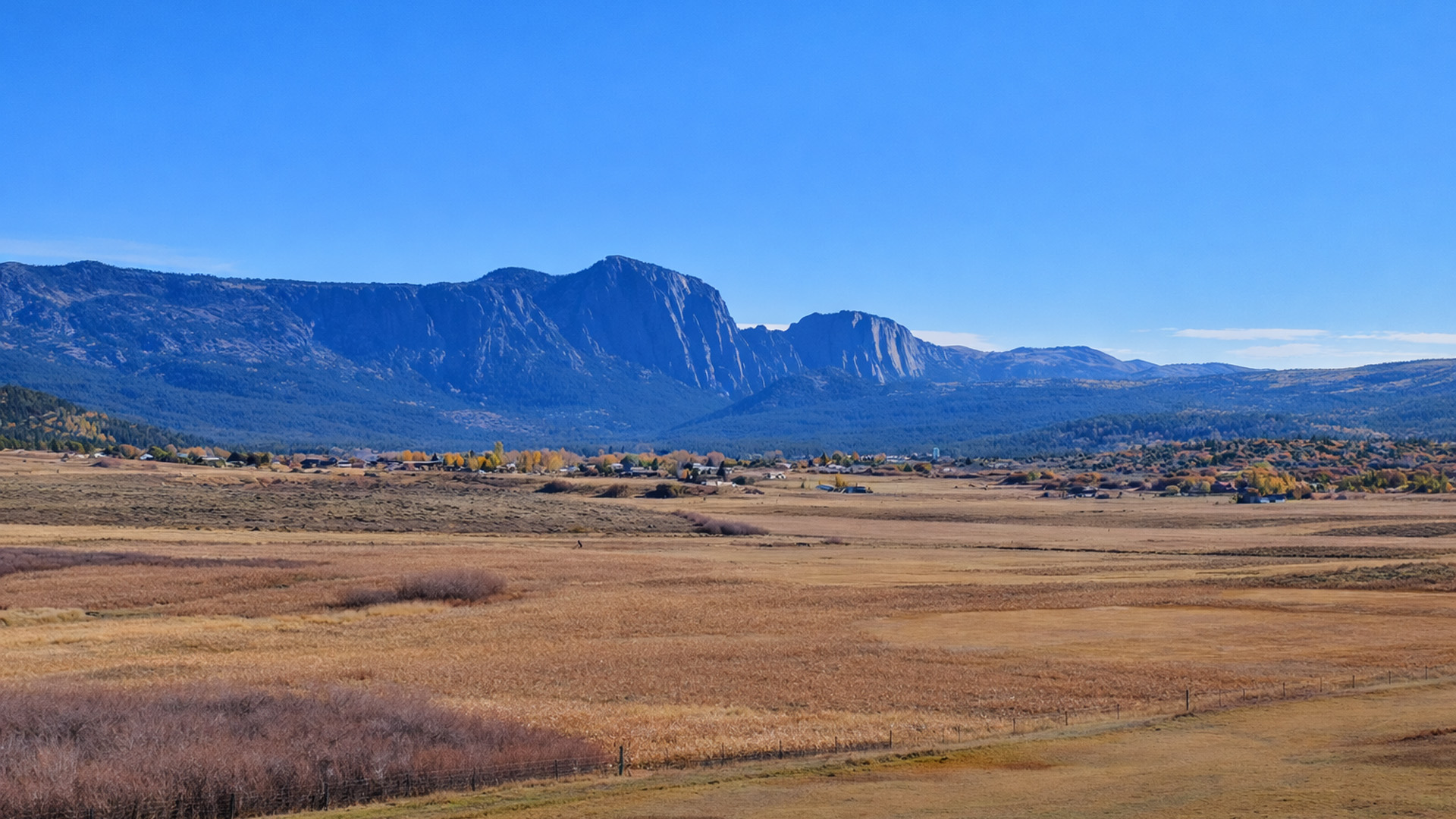 What geological forces shaped this dramatic mountain face?