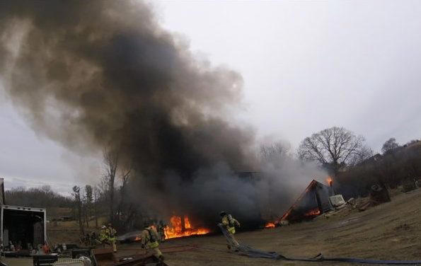 Propane tank blast ignites brush fires during a barn blaze in Galax