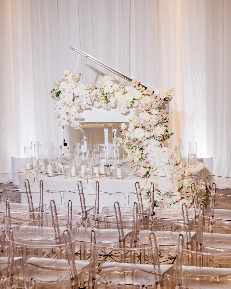 A flower-draped baby grand piano provided the ceremony soundtrack at ...