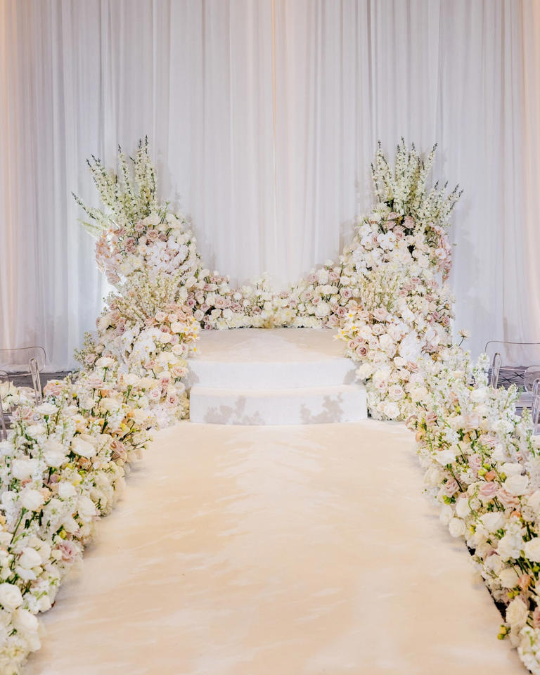 A flower-draped baby grand piano provided the ceremony soundtrack at ...