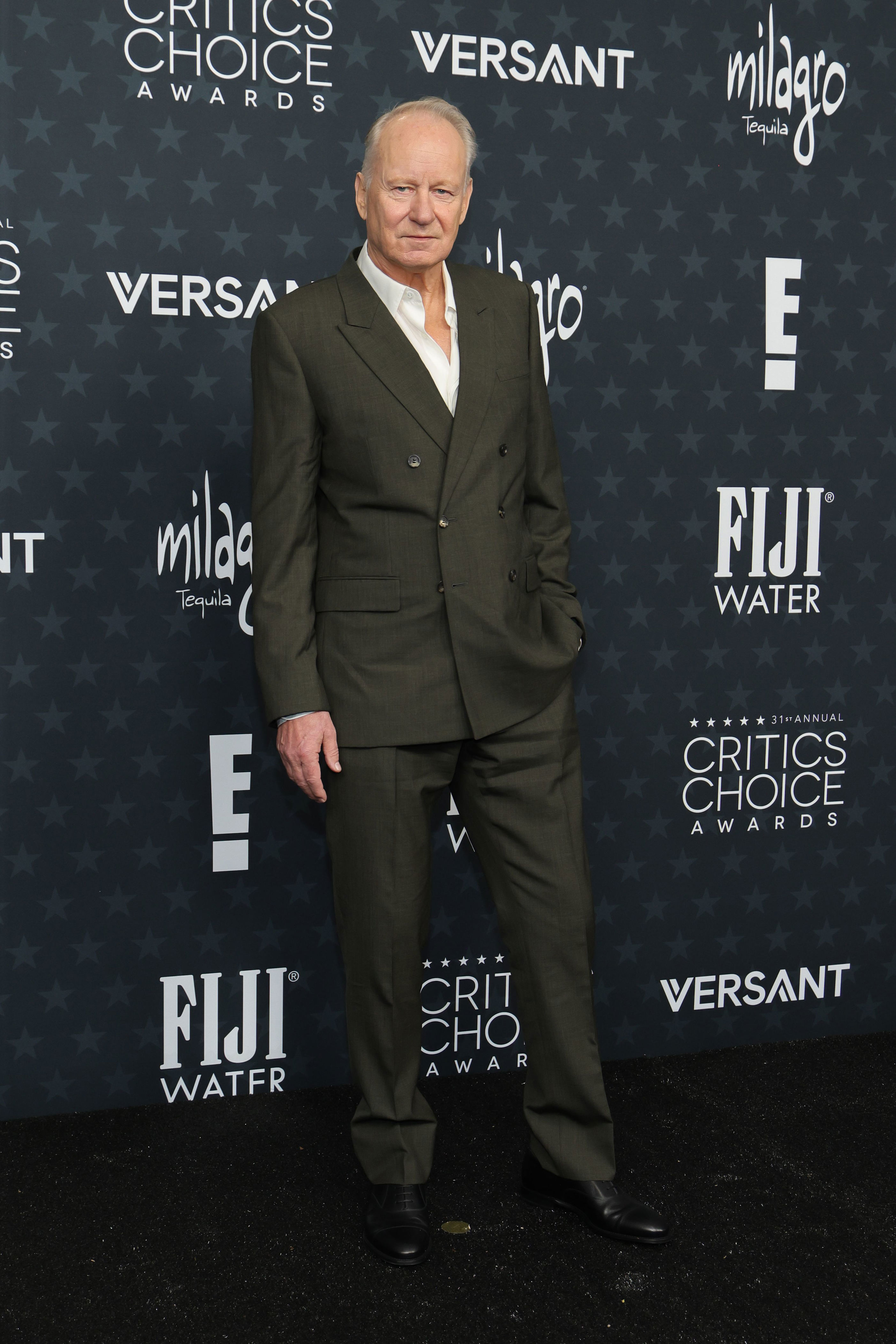 Only Stellan Skarsgård is pulling off the bare-chested suit