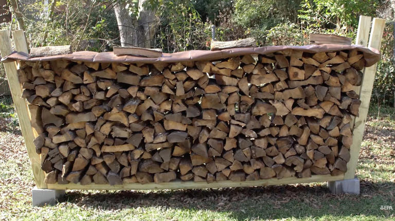 Keep your firewood neat and dry with this genius DIY storage rack idea