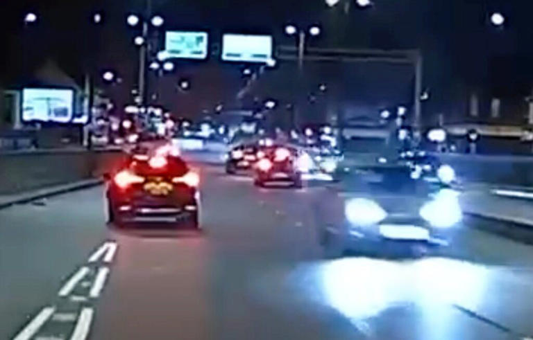 Driver narrowly avoids huge crash after hurtling wrong way down dual ...