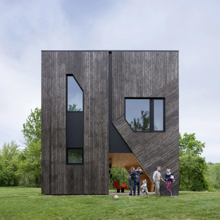 Forma lifts Hudson Valley cedar-clad house on angled legs