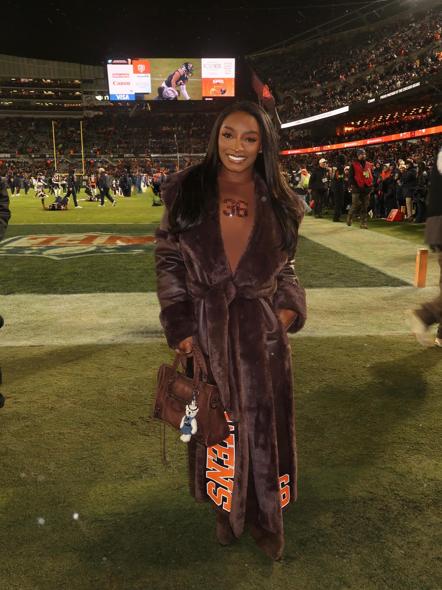 Simone Biles pairs $650 furry Ugg heels with an Hermès Kelly bag for ...