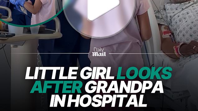 Little girl tenderly looks after grandpa in hospital