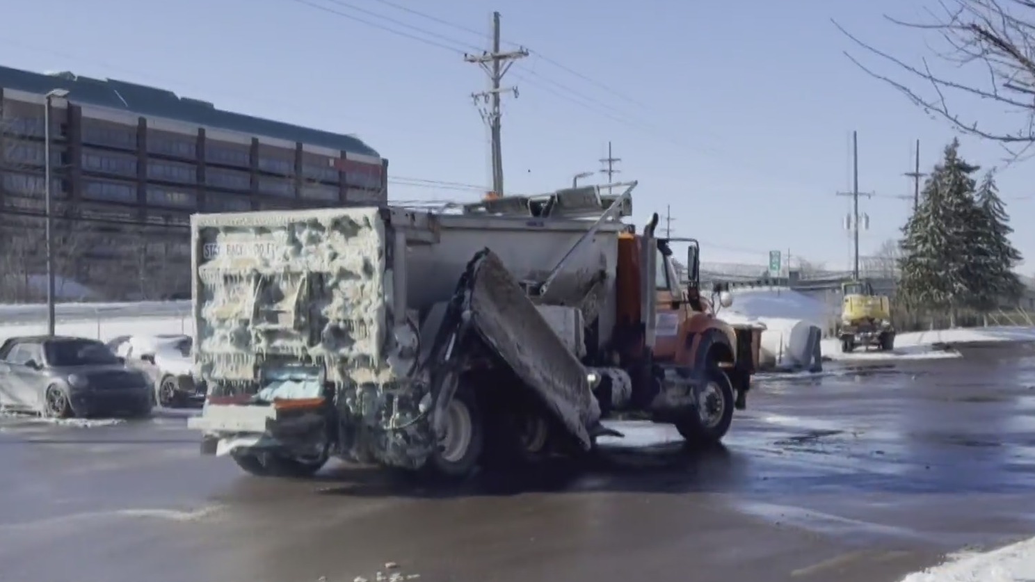 Southeast Michigan road crews scramble to clear snow-covered roads