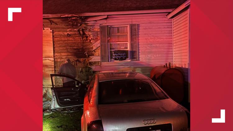 Spokane firefighters battle house fire after car crashes into home