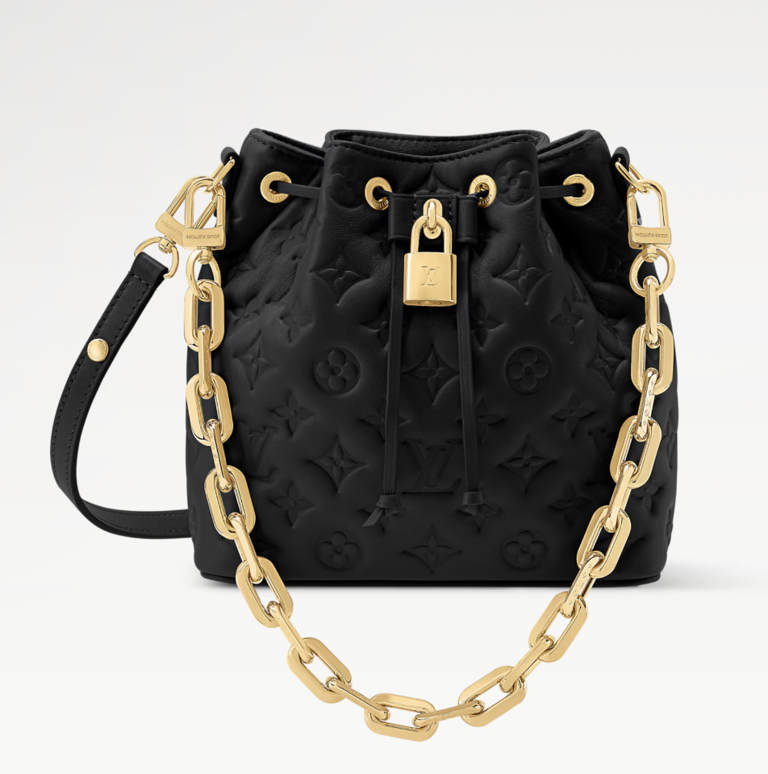 Ana de Armas pairs $280 APL sneakers with $6470 worth of Louis Vuitton bags