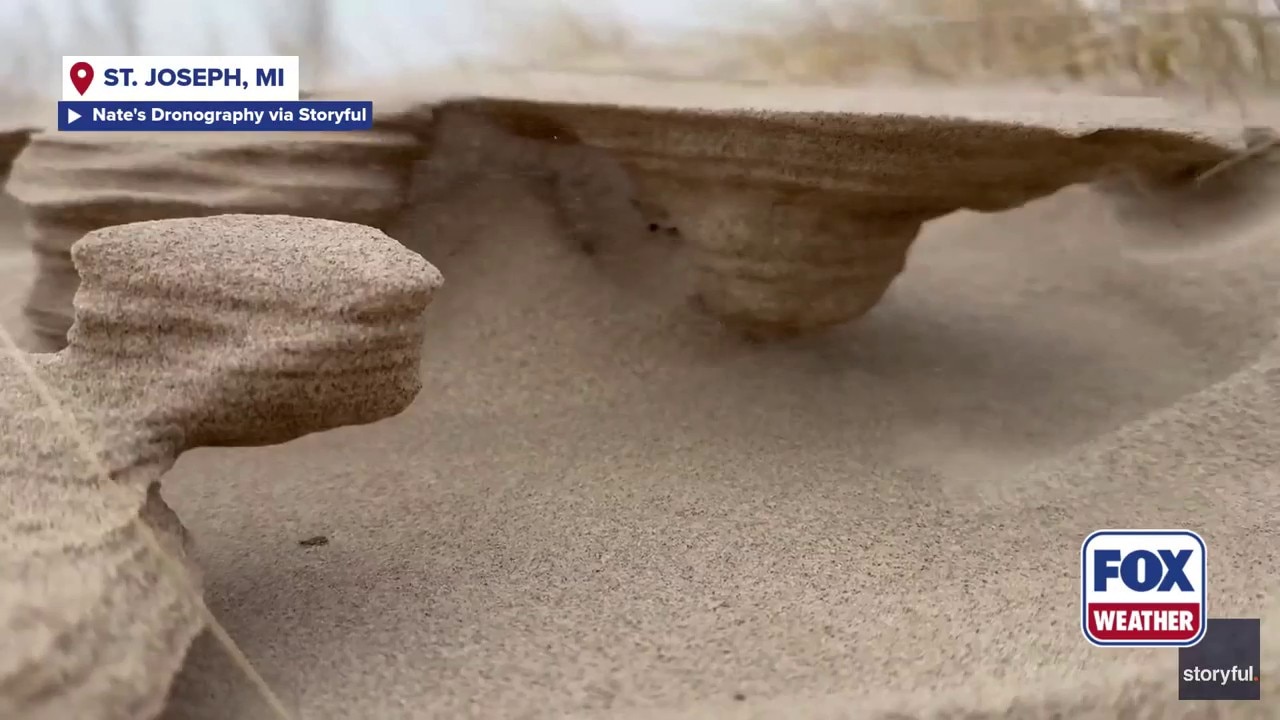 Frozen sand forms mini sculptures on Lake Michigan beach