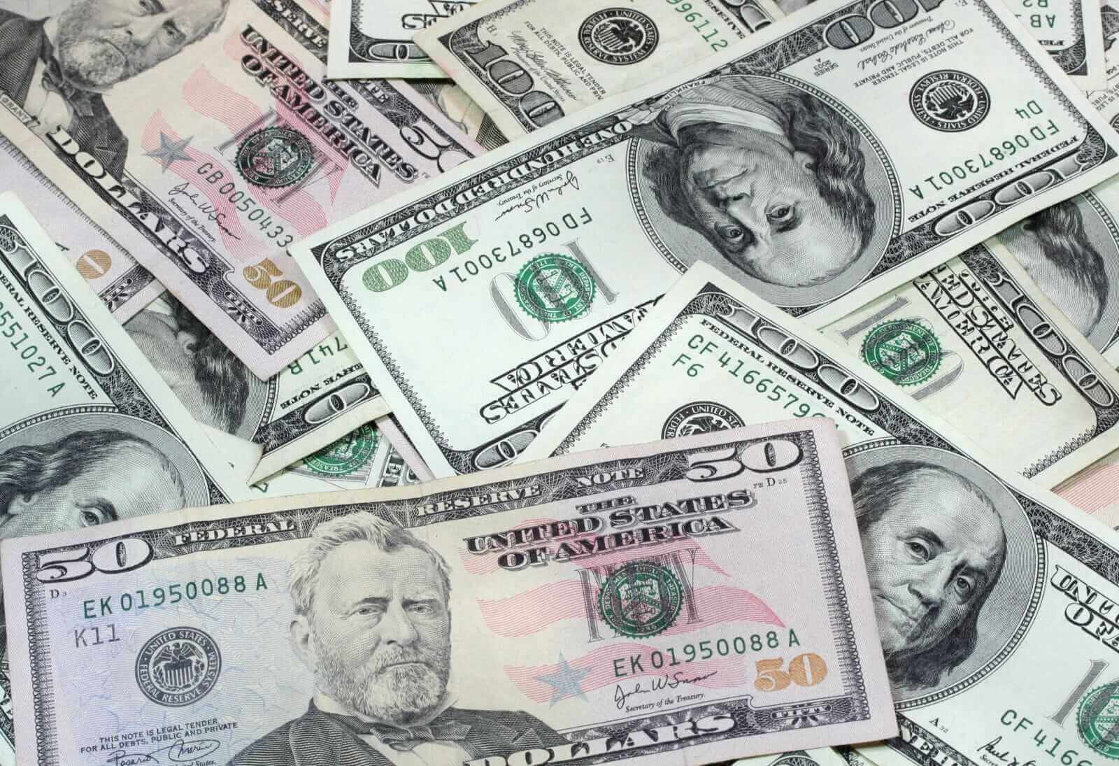 Dollar gains on strong US economic news and hawkish Fed comments