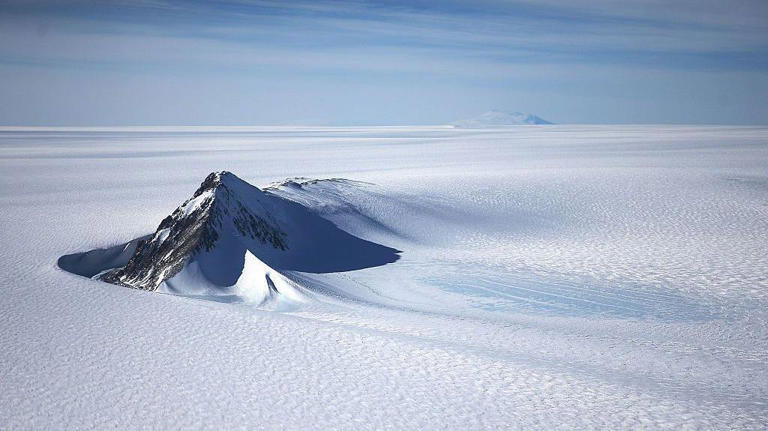 The landscape beneath Antarctica's icy surface revealed in ...